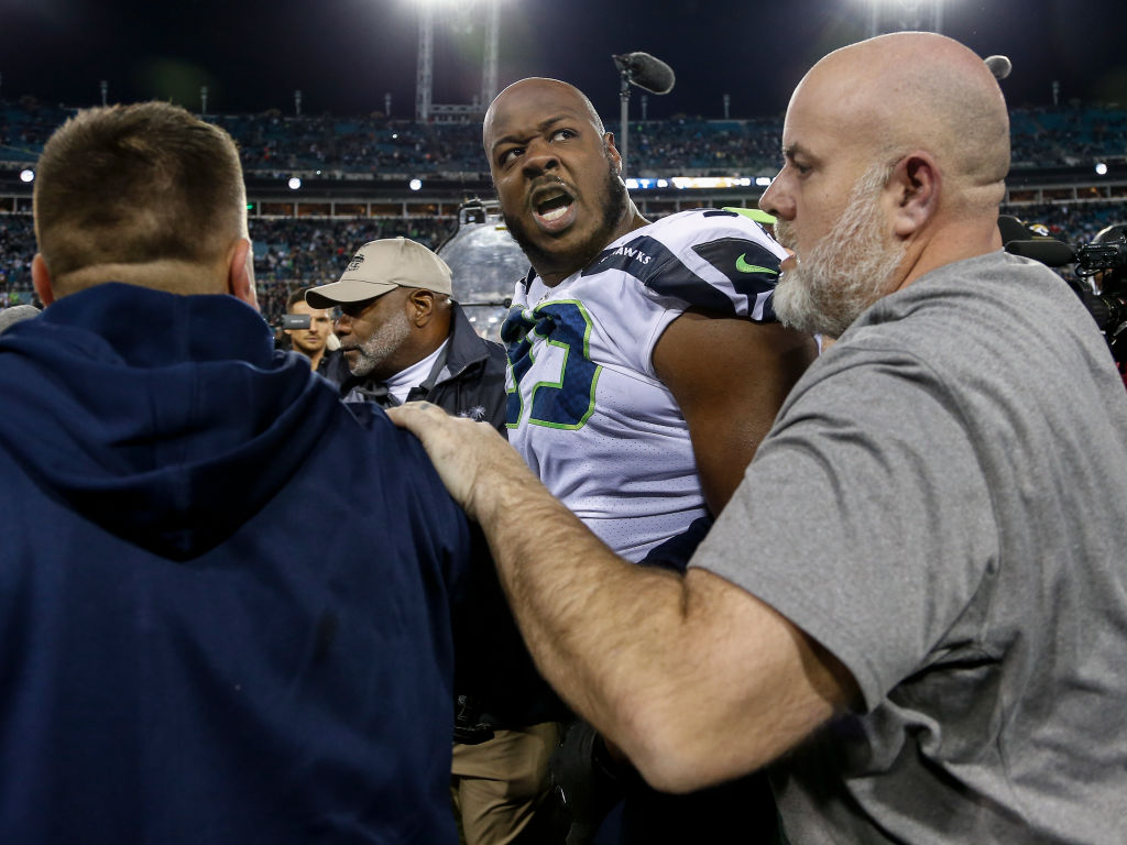NFL Player Fights Fan After Being Hit With Object Following Ejection